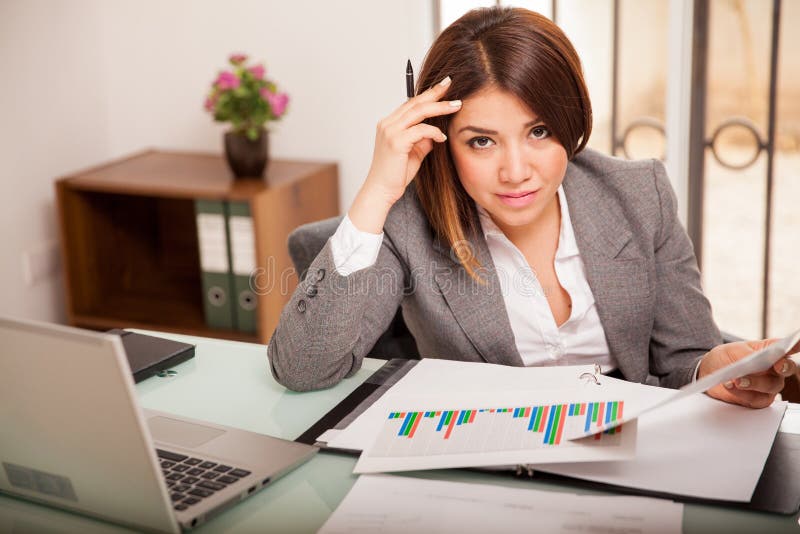 Analyzing some graphs stock photo. Image of attractive - 49730914