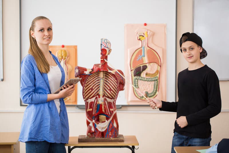 Anatomy Teacher and Her Students during a Lesson. Stock Image - Image ...