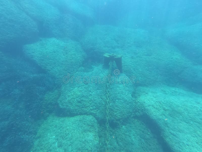 Anchor at the Bottom of the Sea Stuck on Stone Stock Image - Image of ...