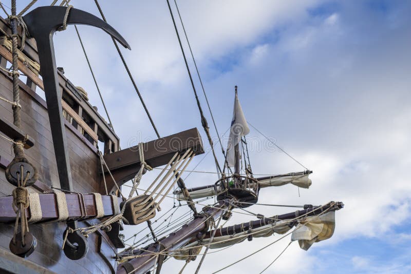 Anchor, Masts and Rigging of Old Pirate Ship on Background of Cloudy ...