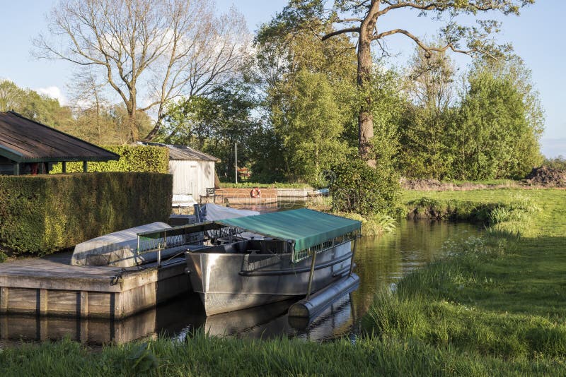 Anchored bed on canal at stock image. Image of roof - 177622401