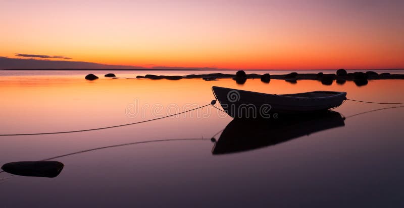 Anchored Rowing Boat at Sunset Stock Image - Image of sunset, rocks ...