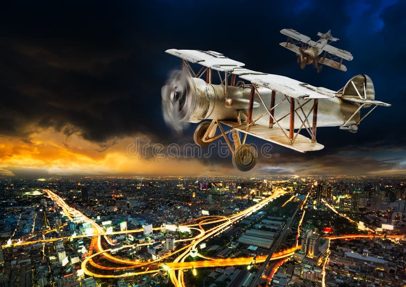 Ancient airplane over city stock photo. Image of wing - 73439736