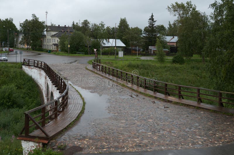 Ancient Arched Brick Bridge with Cobbled Pavement Stock Photo - Image ...