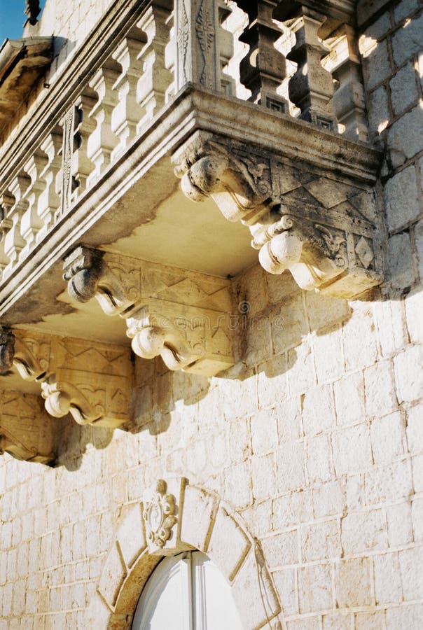 Ancient Balcony with a Balustrade on the Stone Facade of the Building ...