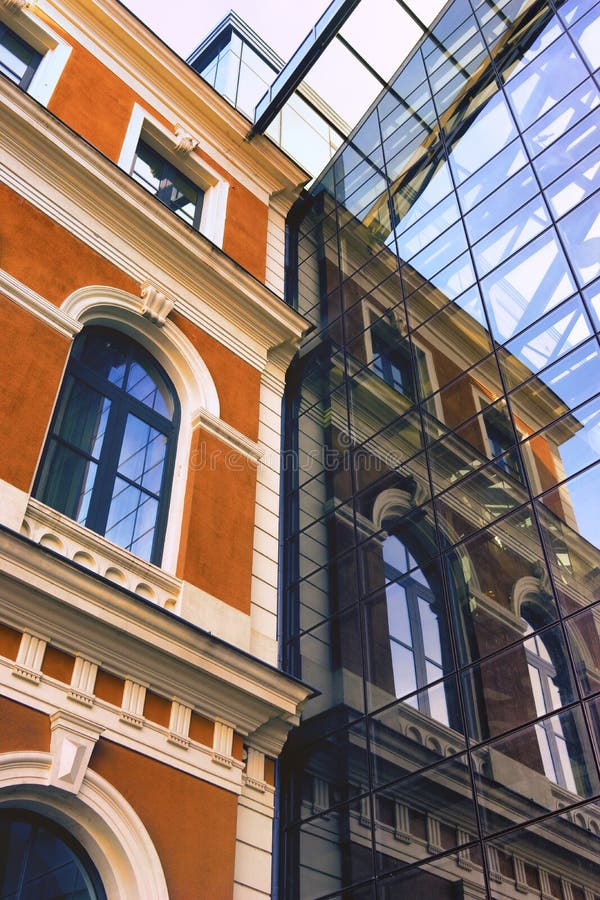 The Ancient Building is Reflected in a Modern House of Glass Stock ...