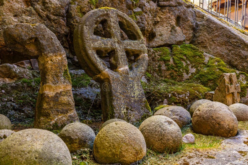 Ancient Celtic Cross and Stone Spheres in Mossy Forest Setting Stock ...