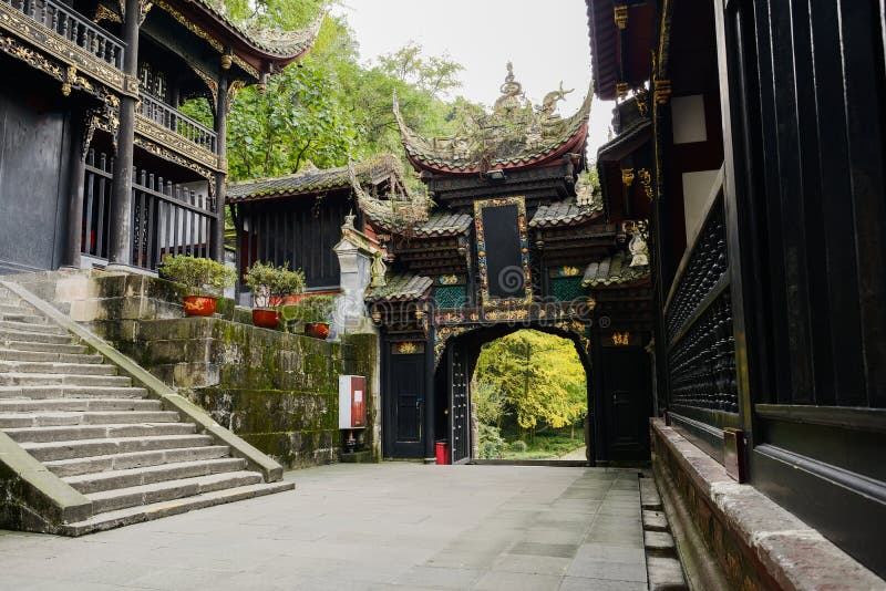 Ancient Chinese Gateway between Aged Buildings Stock Photo - Image of ...