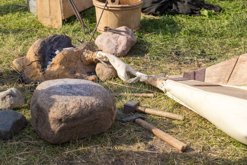 Ancient Clay Forge, Furs, Hammer and Other Tools Stock Photo - Image of ...