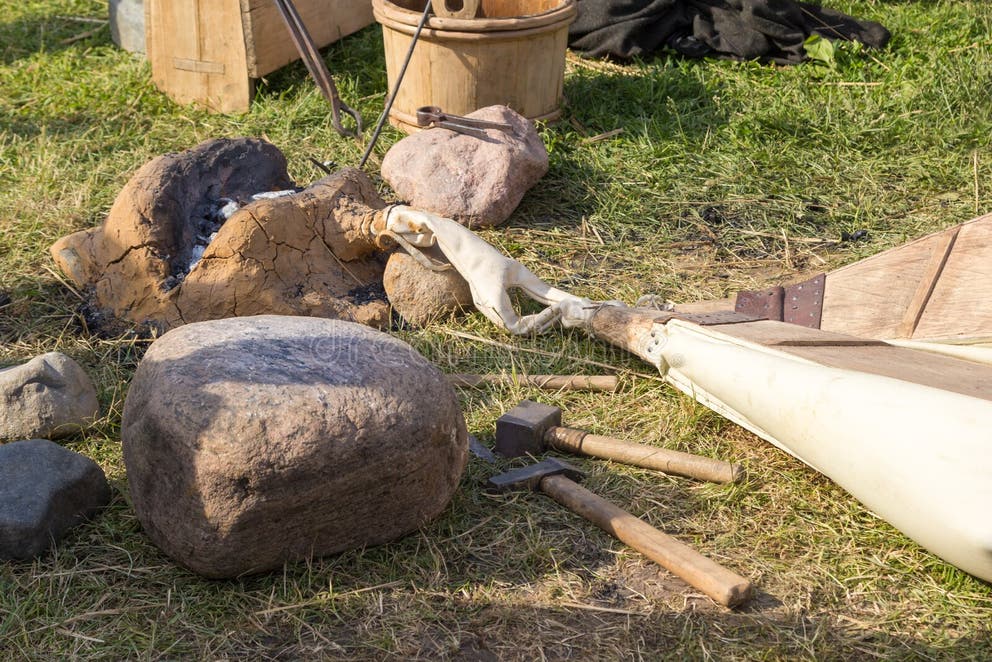 Ancient Clay Forge, Furs, Hammer and Other Tools Stock Photo - Image of ...