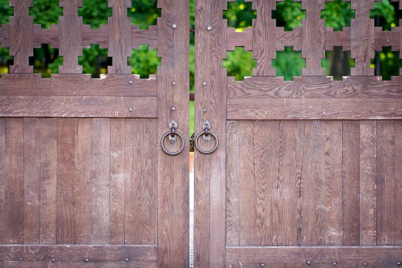 Ancient Closed Wooden Gate with Two Door Knocker Rings Stock Photo ...