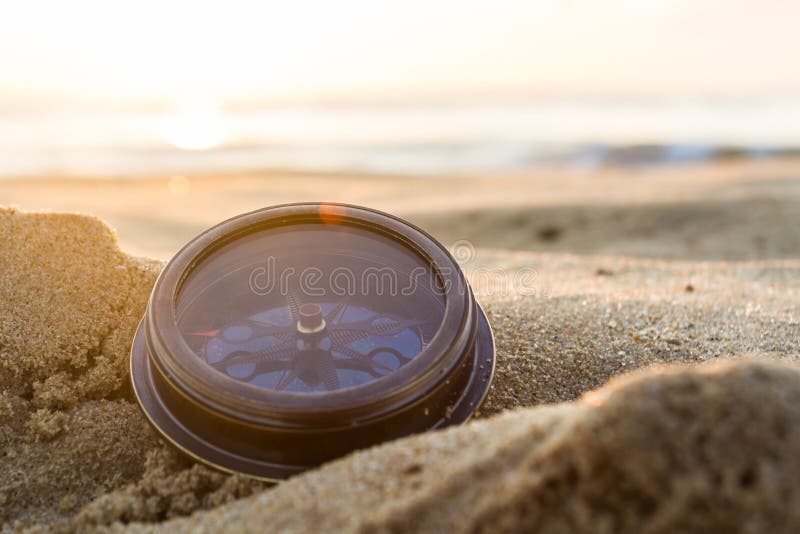 Ancient Compass on the Sand at the Beach Sunrise. Stock Photo - Image ...