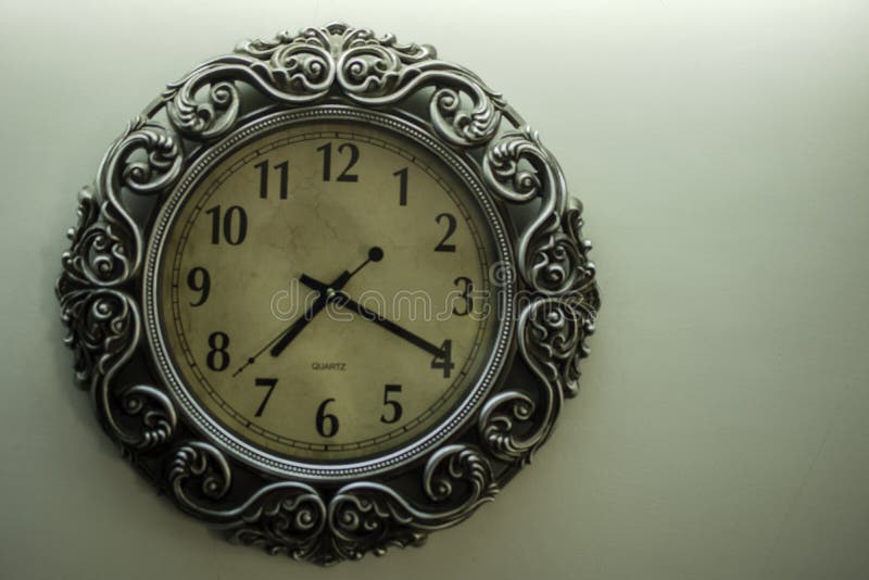 Ancient Designer Wall Clock with Light Yellow Back Ground Showing Time ...