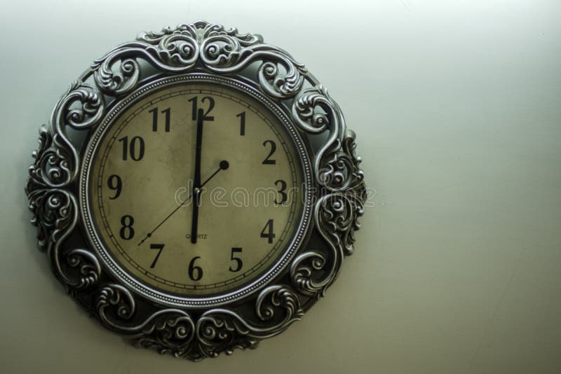 Ancient Designer Wall Clock with Light Yellow Back Ground Showing Time ...