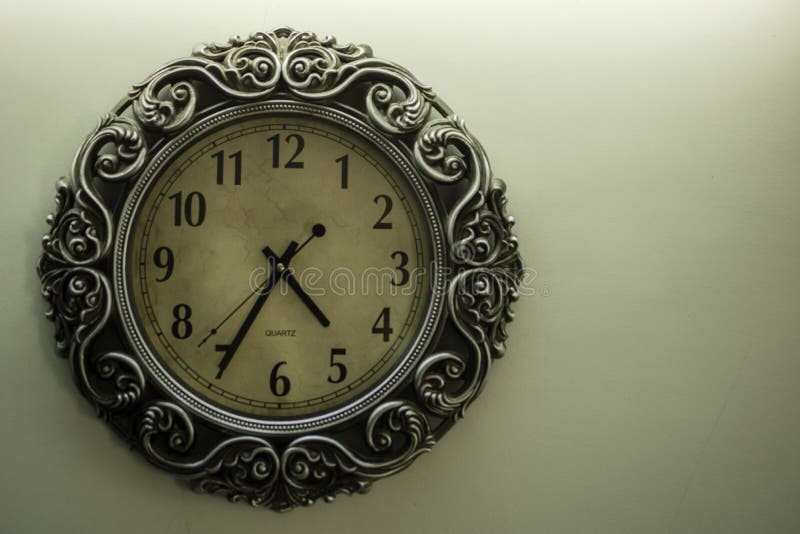 Ancient Designer Wall Clock with Light Yellow Back Ground Showing Time ...