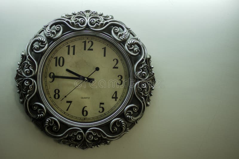 Ancient Designer Wall Clock with Light Yellow Back Ground Showing Time ...