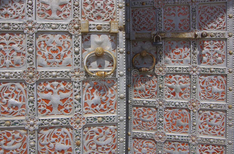 An Ancient Door with a Carved Metal Pattern and a Handle in the Form of ...