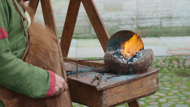 Medieval Method of Forging Iron, the Blacksmith Forges an Iron Nail ...