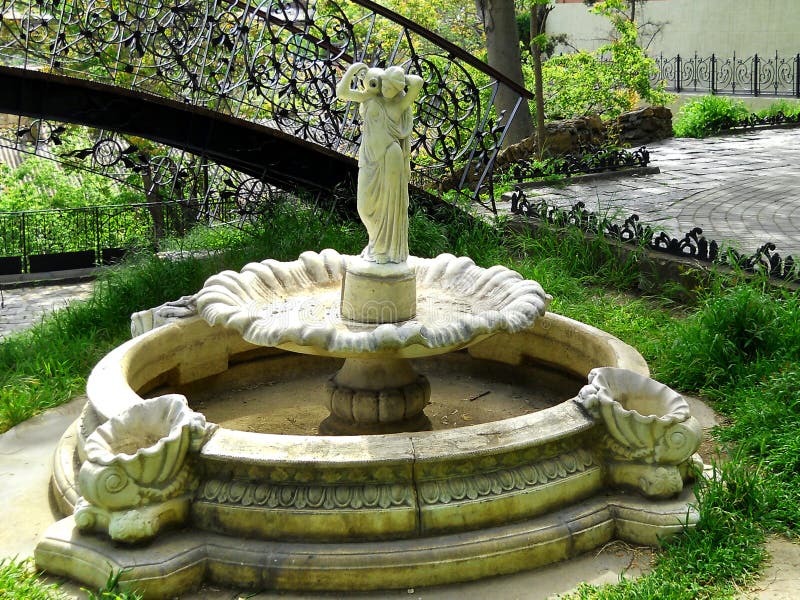 An Ancient Fountain with a Statue of a Woman . Stock Photo - Image of ...