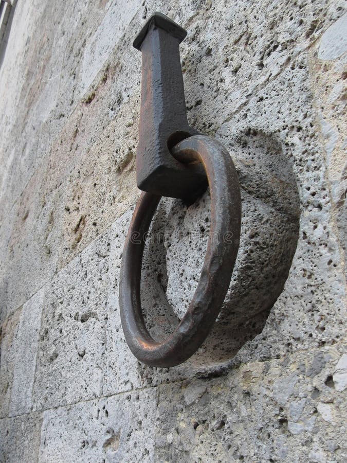 Ancient Iron Hoop Hanging on Stone Wall Stock Image - Image of vintage ...