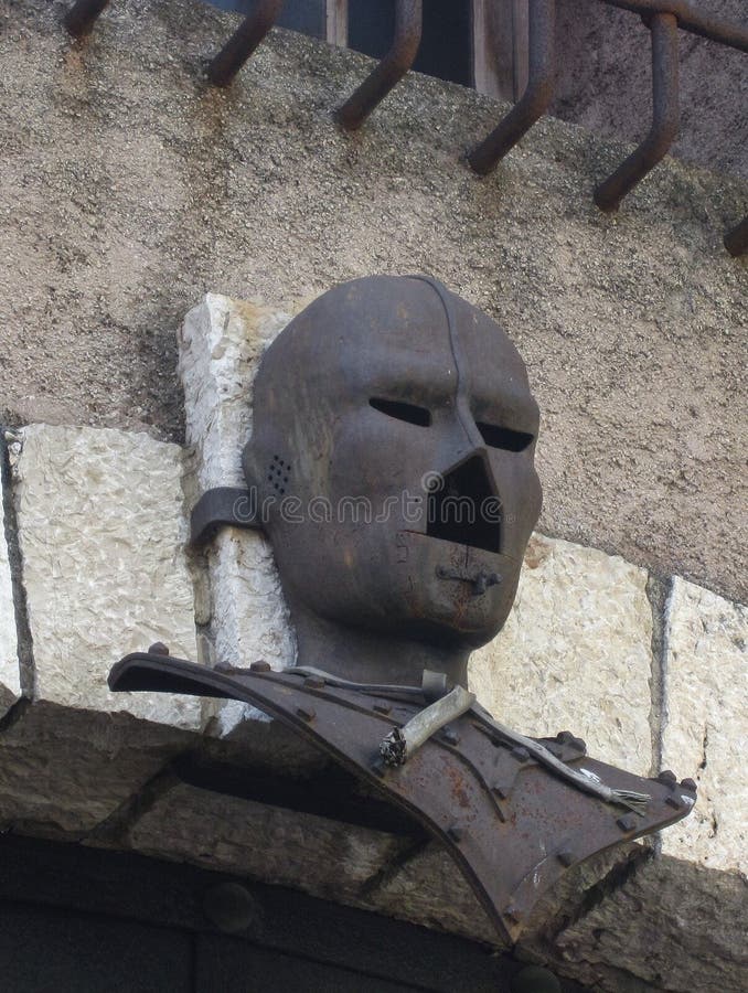 The iron mask on the wall stock image. Image of creatures - 107471345
