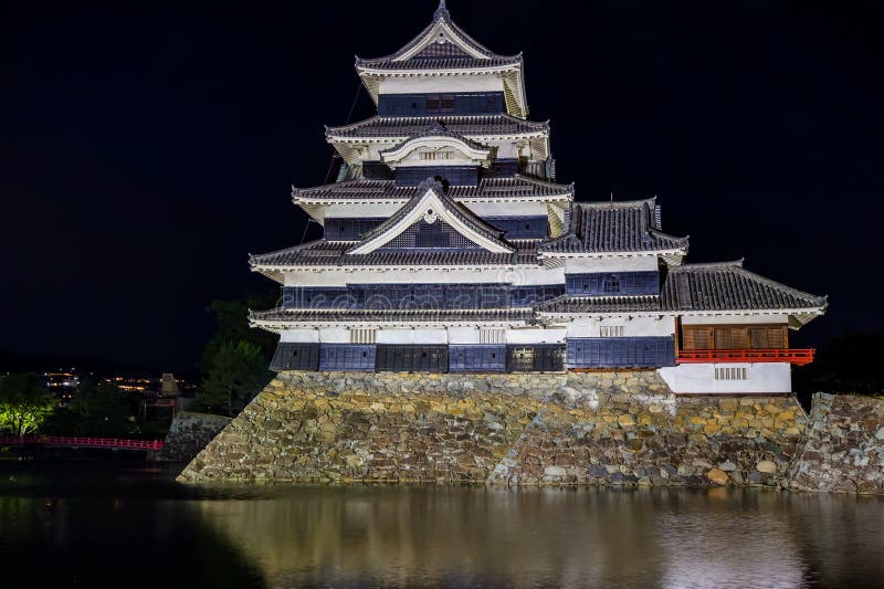 Ancient Japanese Matsumoto Castle at Night with a Reflection in the ...