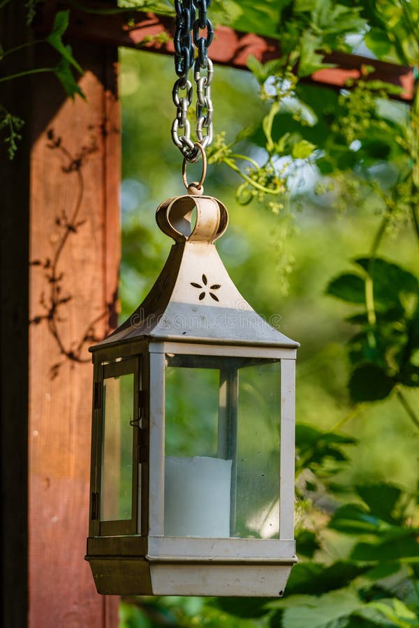 Ancient lamp with candle stock photo. Image of park - 100333302