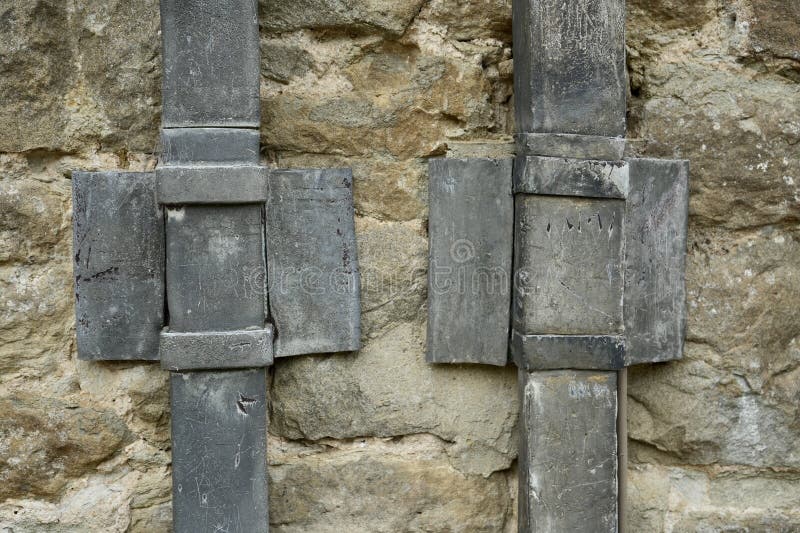 Ancient Lead Downpipes on a Stone Wall, England, UK. Stock Image ...