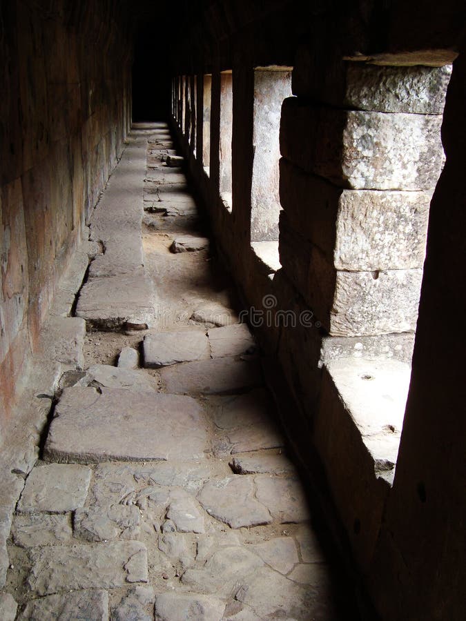 Rocky Hallway in a Cave with a Light at the End Stock Photo - Image of ...