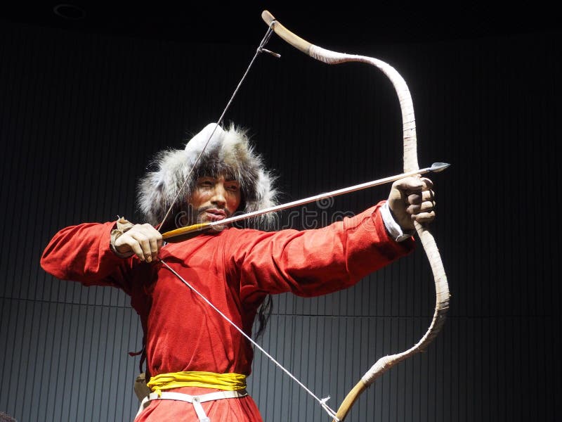 Ancient Man Holding a Bow and Arrow and Aiming it at a Target Stock ...