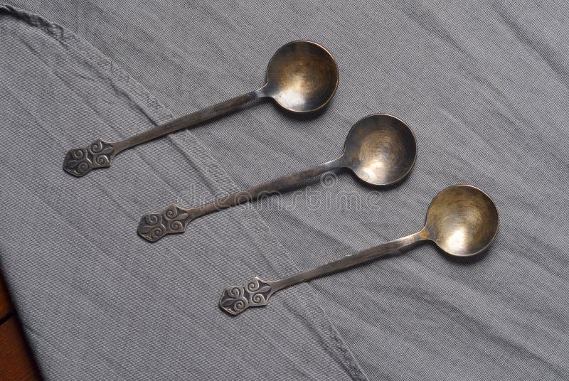 Ancient Metal Tablespoons on Grey Fabric Close-up Stock Image - Image ...