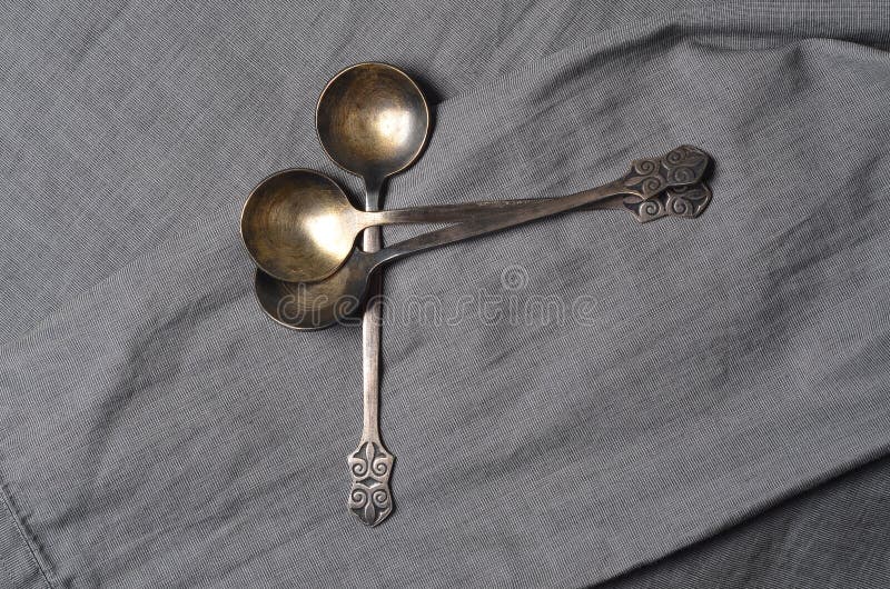 Ancient Metal Tablespoons on Grey Fabric Close-up Stock Image - Image ...