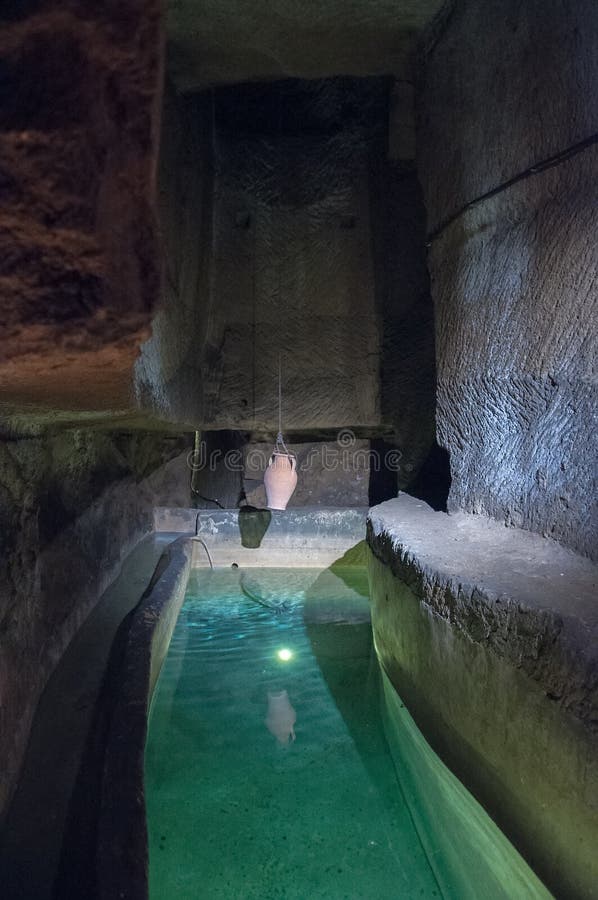 Ancient Pool of Drinking Water in the Catacombs of Naples Stock Photo ...