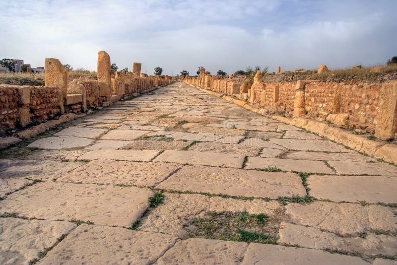 Ancient Road Paved with Cobblestone and Going Up through Hills. Stock ...