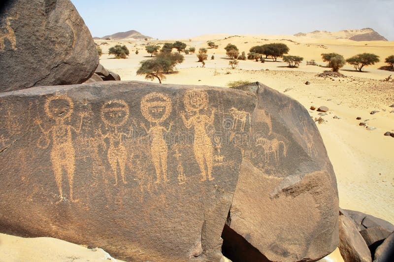 Ancient Rock Art in Sahara Depicting Four Figures Stock Photo - Image ...