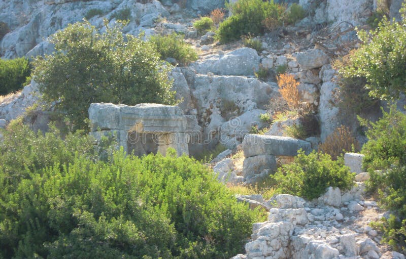 Ancient rocks with caves stock image. Image of wilderness - 243446287