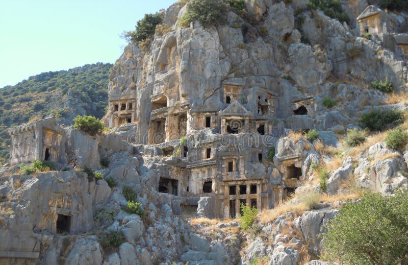 Ancient rocks with caves stock image. Image of cliff - 243446353