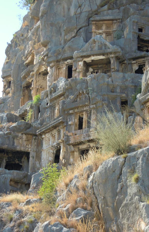 Ancient rocks with caves stock photo. Image of ancient - 243446362