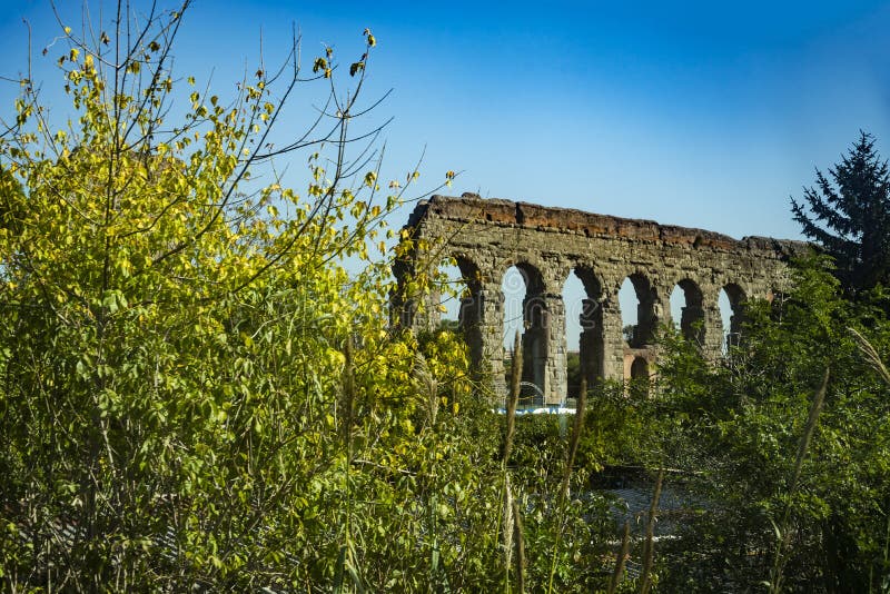 Ancient Roman Aqueduct Ouside Rome, Surrounded by Trees Stock Photo ...