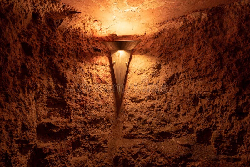 Ancient Rough Wall In Cave With Light From Lamp In Darkness Stock Image ...