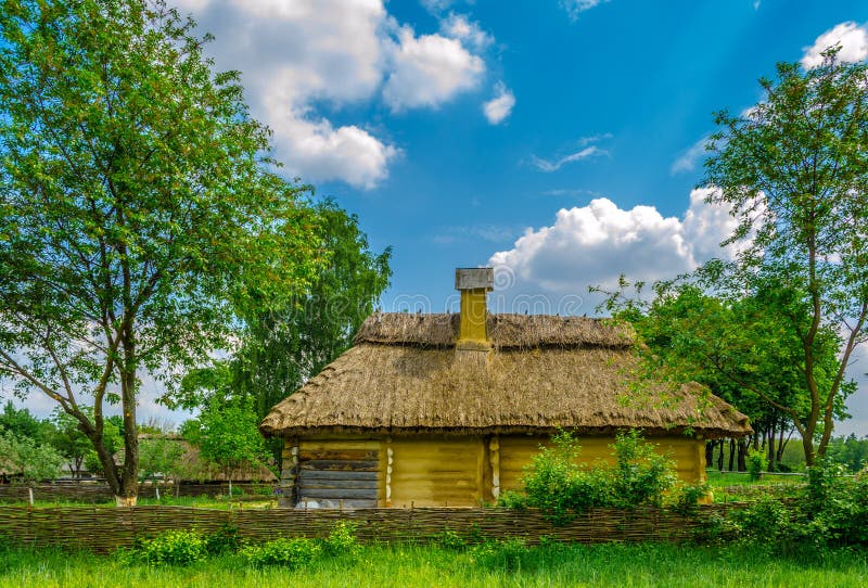 Ancient Rural Cottage with a Straw Roof Stock Photo - Image of cloudy ...