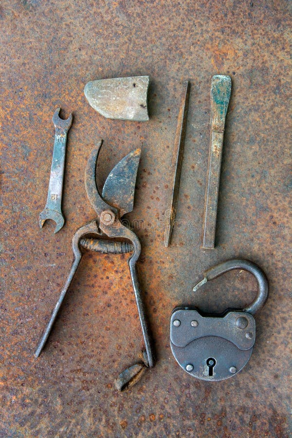 Ancient Rusty Tools on a Metal Surface. Steampunk Style Stock Image ...