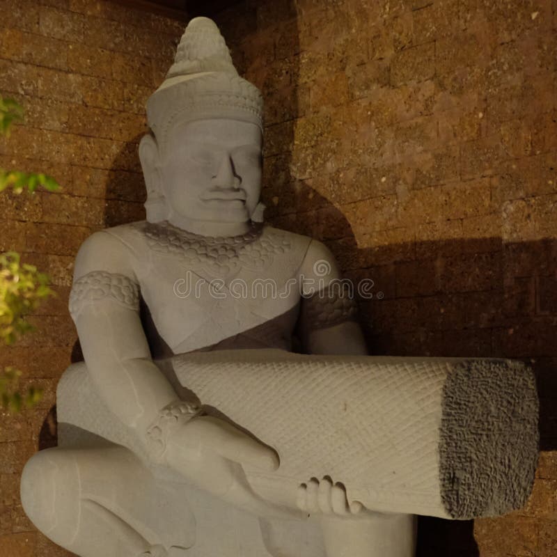 Ancient Sculpture of a Man with a Log in His Hand Stock Photo - Image ...