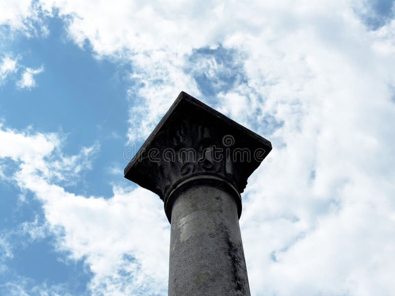 Ancient Stone Column Against a Cloudy Blue Sky Editorial Photo ...