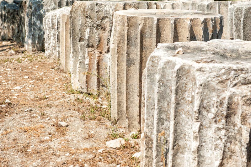 Ancient Stone Columns with Weathered Surfaces Stand in Ruins ...