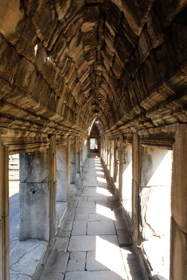 Ancient Stone Corridor Bathed in Sunlight. Stone Vaults Stock Photo ...