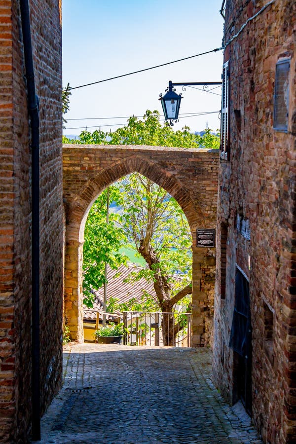 An Ancient Stone-covered Street with a Nature View Under a Vault Stock ...