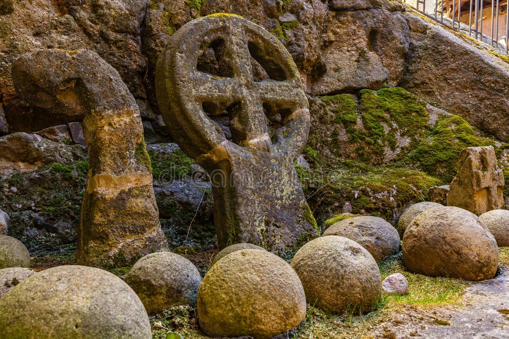 Ancient Stone Cross and Spheres in Mossy Forest Setting Stock Photo ...