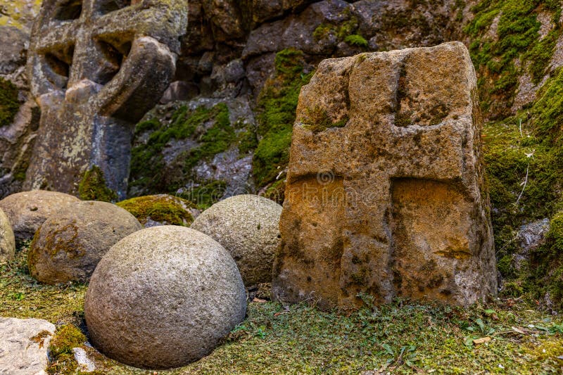 Ancient Stone Crosses and Spherical Rocks in Mossy Forest Setting Stock ...