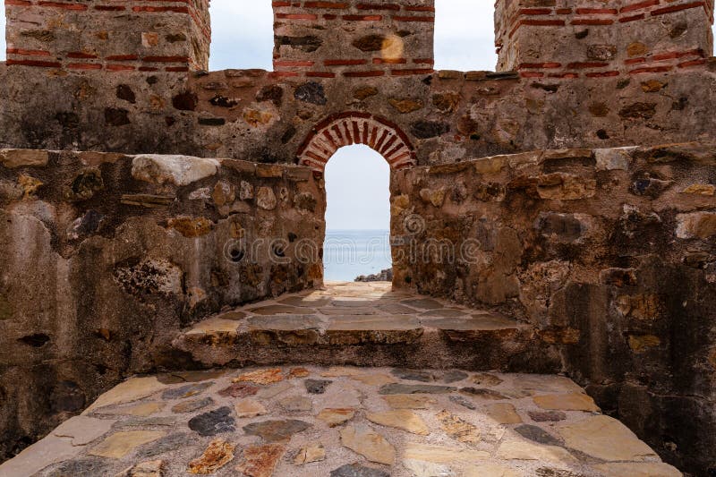 Ancient Stone Fortress Gateway Overlooking a Tranquil Ocean Horizon ...